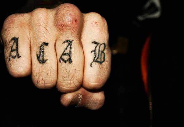 The hidden meanings of common prison tattoos - DesignGuide